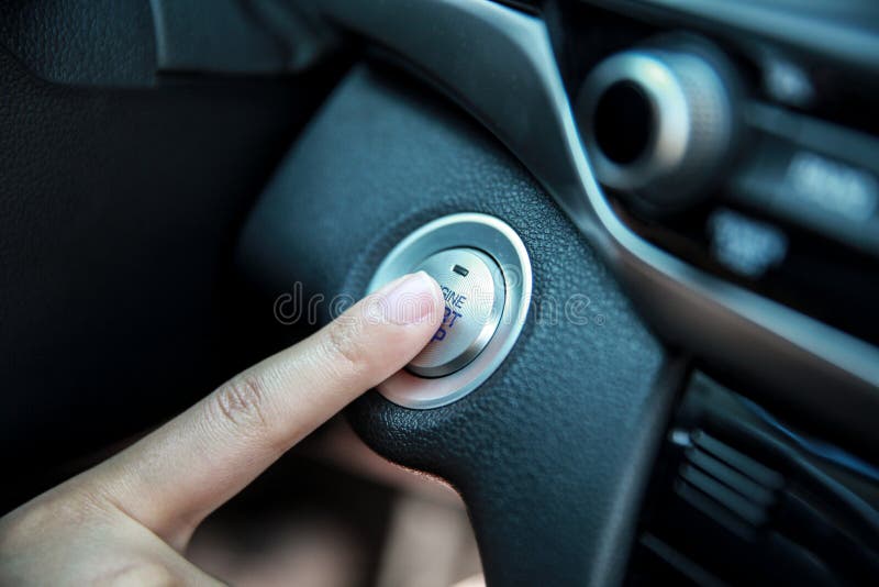 Hand Pressing a Car Engine`s Start and Stop Button Stock Photo - Image ...