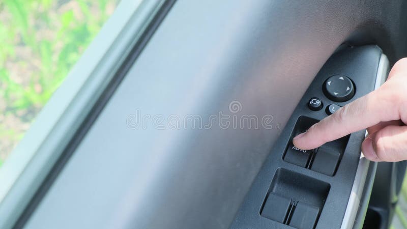 Hand Pressing of Car Window Button Close Up Stock Photo - Image of ...
