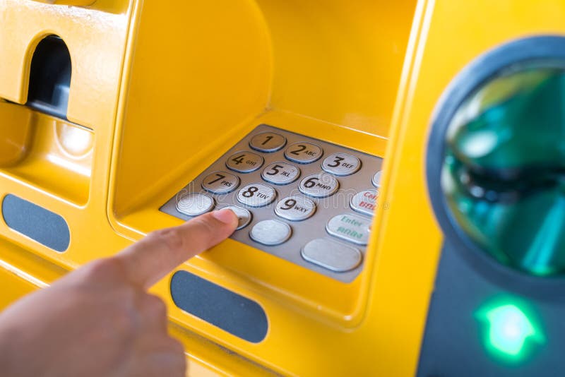 Hand Pressing the Code from the ATM Focuses on the Numbers and the ...