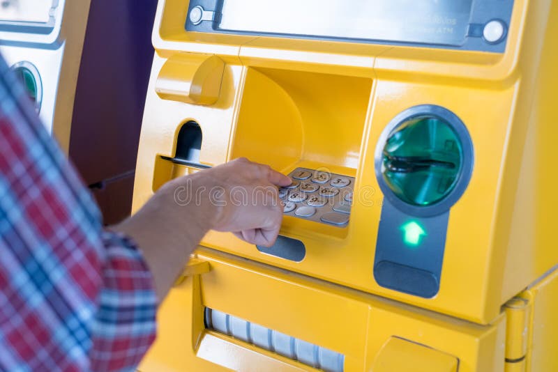 Hand Pressing the Code from the ATM Focuses on the Numbers and the ...