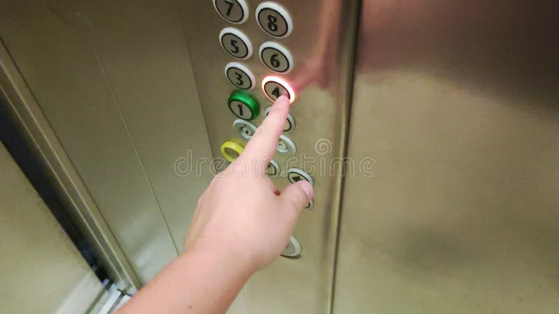 Hand Pressing Floor Button in Elevator, Close-up. Service Lift Stock ...