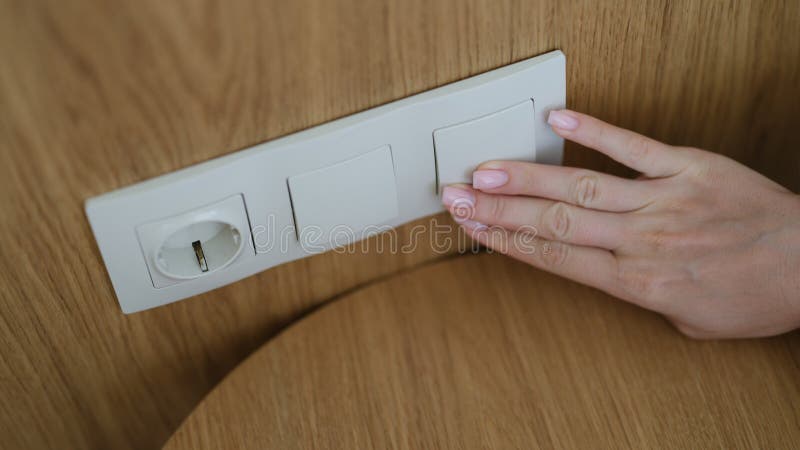 Hand Pressing Light Switch in Wall of House Closeup Stock Image - Image ...