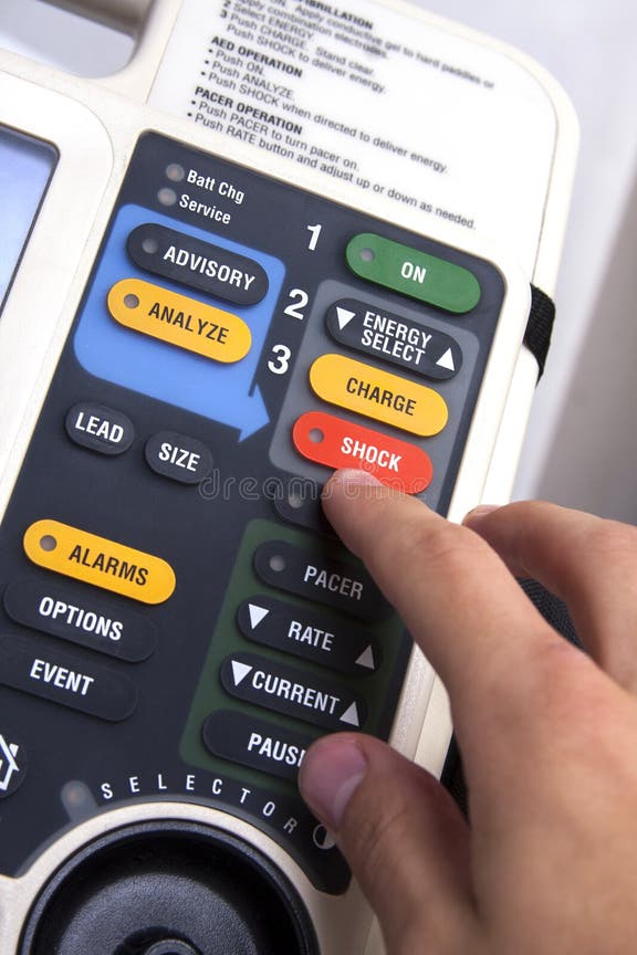 Hand Pressing a Red Shock Button on a Modern Defibrillator Stock Image ...