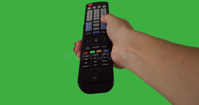 Hand Pressing Remote Control Button Over Green Background Stock Video ...