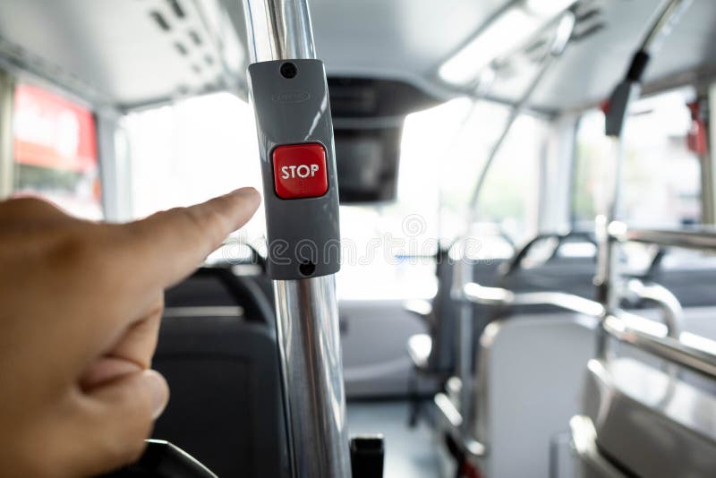 A Hand Pressing the Stop Button Inside a Public Bus Stock Image - Image ...
