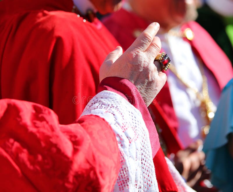Priest with Large Ring during the Blessing of the Faithful at the End ...