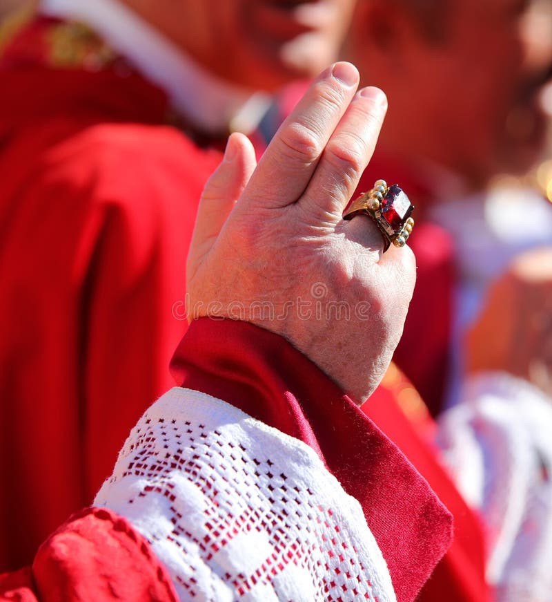 Priest with a Ring with a Large Red Ruby while Giving the Blessing To ...