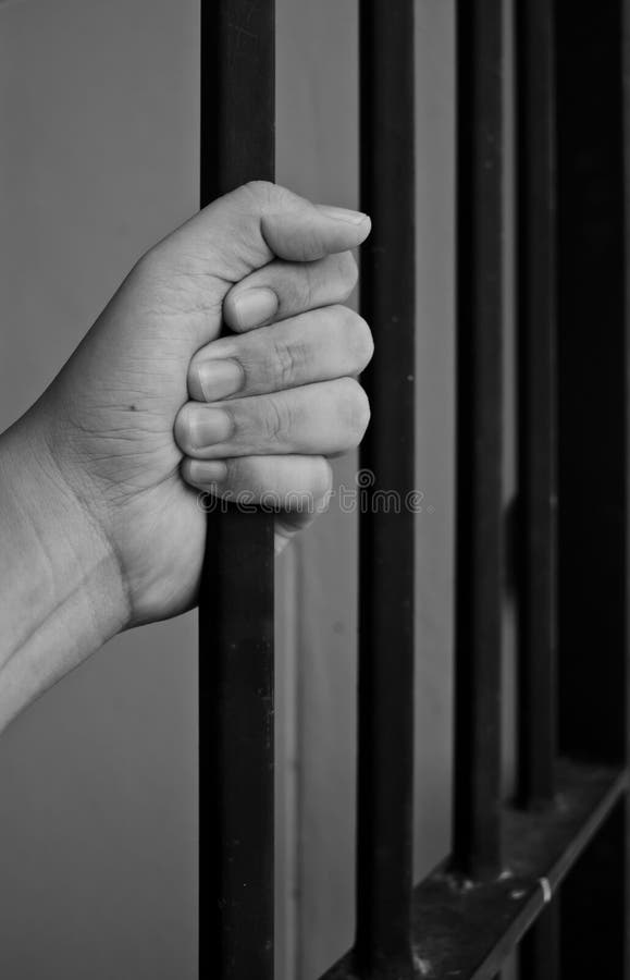 Hand of the prisoner stock photo. Image of freedom, white - 33459590