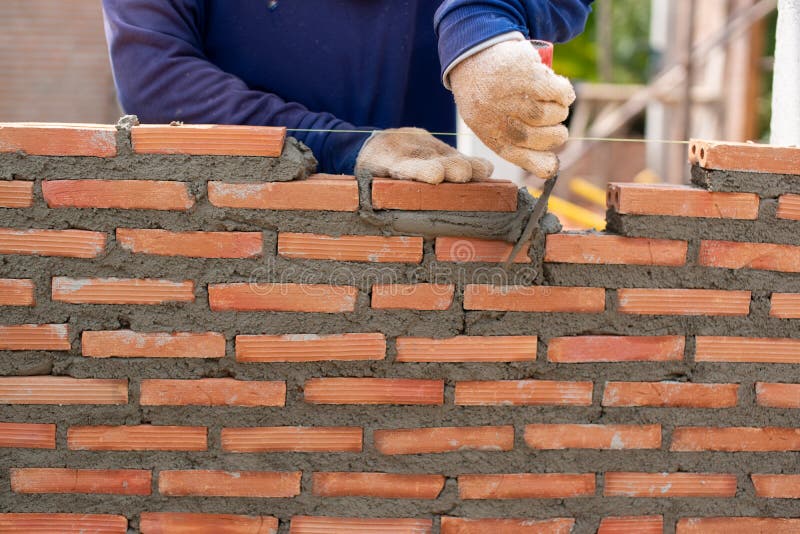 Hand of Professional Construction Worker Laying Bricks in Wall ...