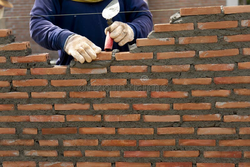 Hand of Professional Construction Worker Laying Bricks in Wall ...