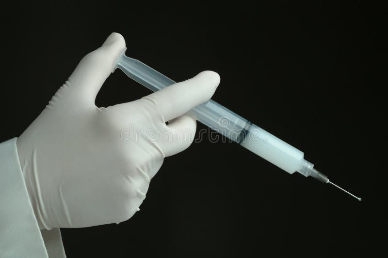 Hand with Protective Glove Injecting Drug with Syringe. Stock Image ...