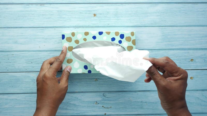 Top View of Hand Pull Out a Piece of Tissue from Tissue Paper Box Stock ...