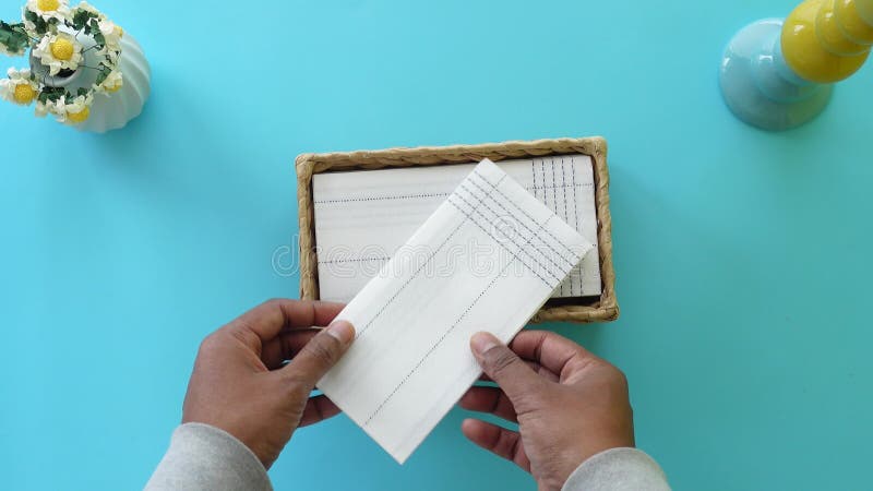Top View of Hand Pull Out a Piece of Tissue from Tissue Paper Box Stock ...