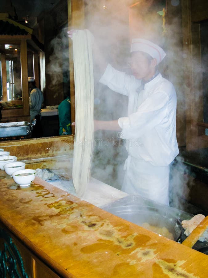Hand pulled noodles editorial stock photo. Image of making - 69064958