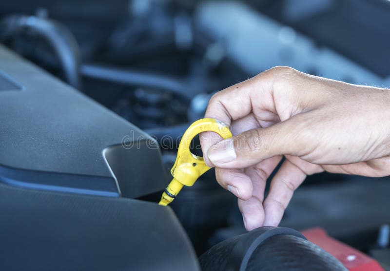 Hand Pulling Dipstick and Checking Engine Oil Stock Photo - Image of ...