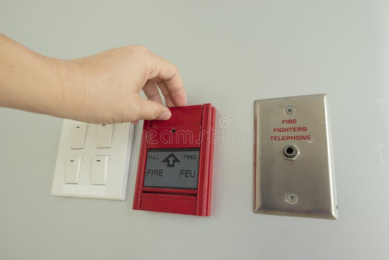 The Hand is Pulling Fire Alarm Signal on the Wall Stock Image - Image ...