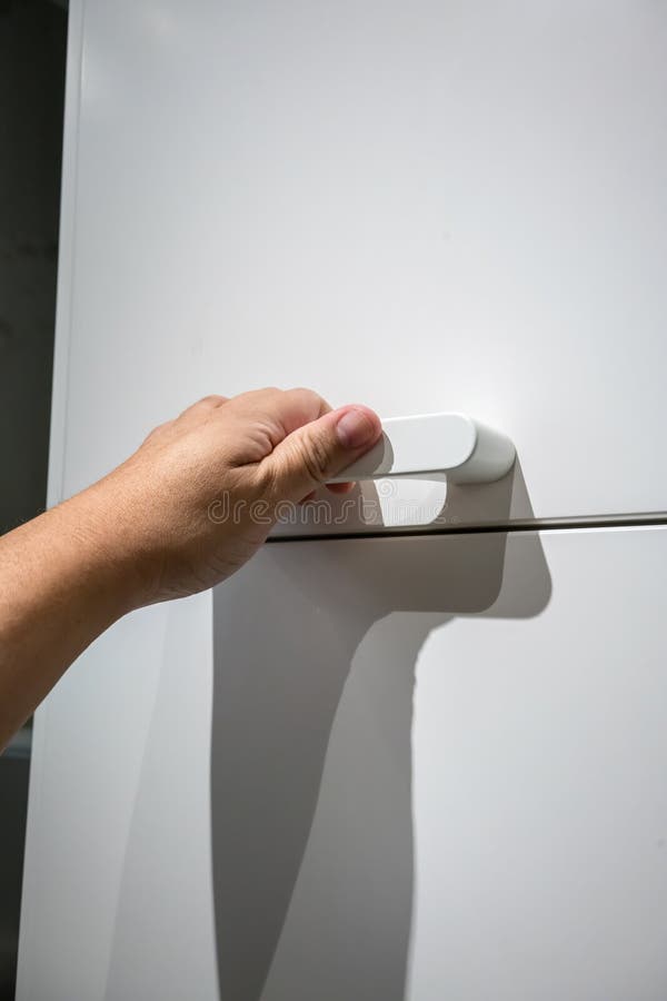 Hand Pulling a Handle of White Upper Drawer. Stock Image - Image of ...