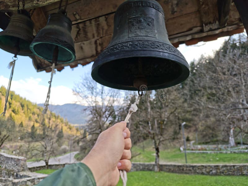 Hand Pulling Rope of Large Bell in Mountain Landscape Stock Image ...
