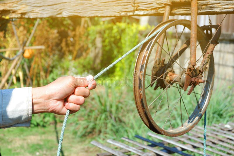 The Hand is Pulling the Rope To Bring Water from the Well by Bucket ...