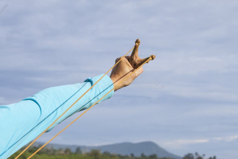 Hand pulling sling shot stock image. Image of catapult - 32009719