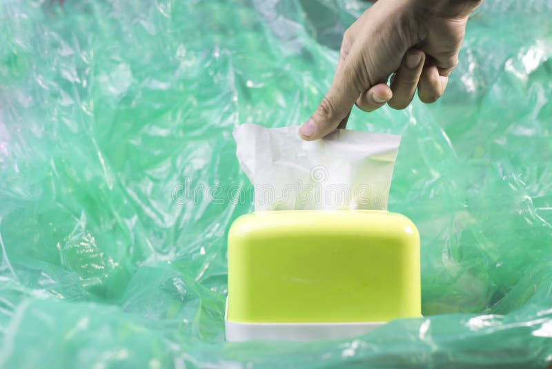 The Hand Pulling Tissue in a Green Tissue Box Green Background Stock ...