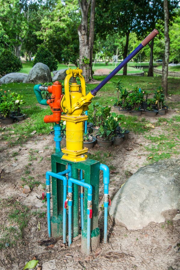 Hand pump groundwater stock image. Image of flowers, aquifer - 57808029