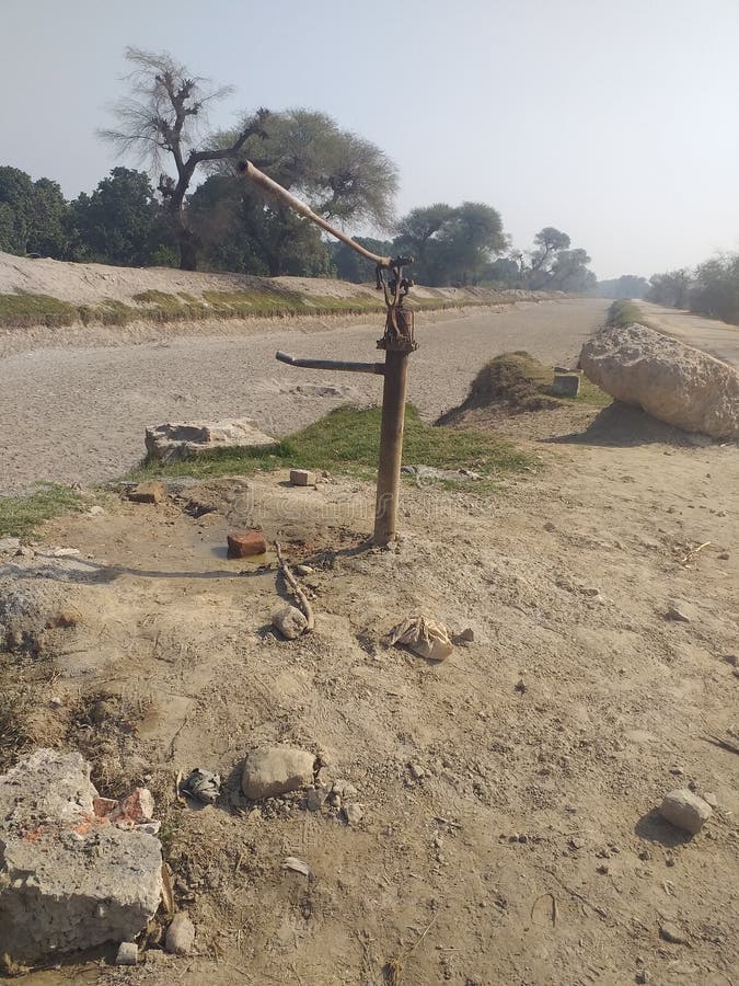 A hand pump stock photo. Image of rock, edge, landscape - 241007010