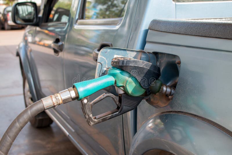Gas Hand Pumping Gas into Car Stock Photo - Image of person, natural ...