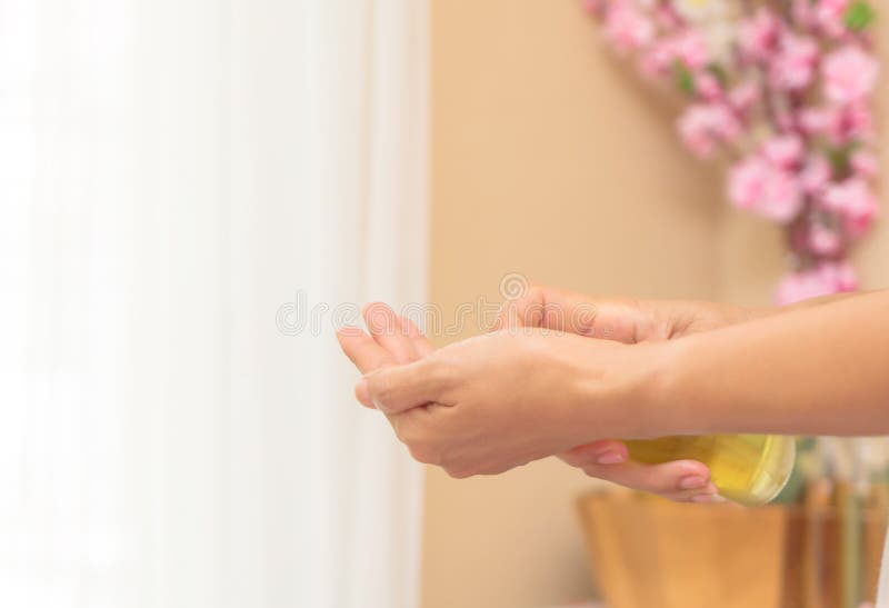 Hand Pumping Out Spa Oil Lotion from Container Stock Photo - Image of ...