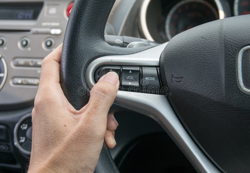A Hand Pushes the Cruise Control Button on a Steering Wheel. Stock ...