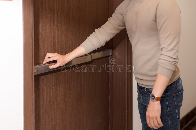 Hand is Pushing/opening the Emergency Fire Exit Door Stock Image ...