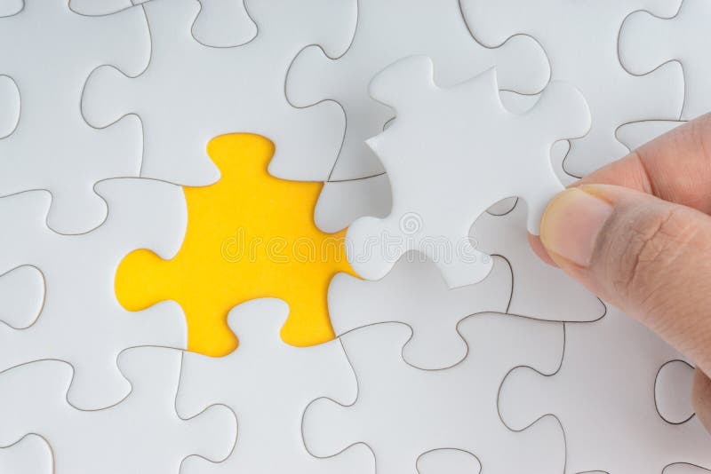 Hand Put the Last Piece of Jigsaw Puzzle Closeup To Complete the ... Hand Put the Last Piece of Jigsaw Puzzle Closeup To Complete the ...