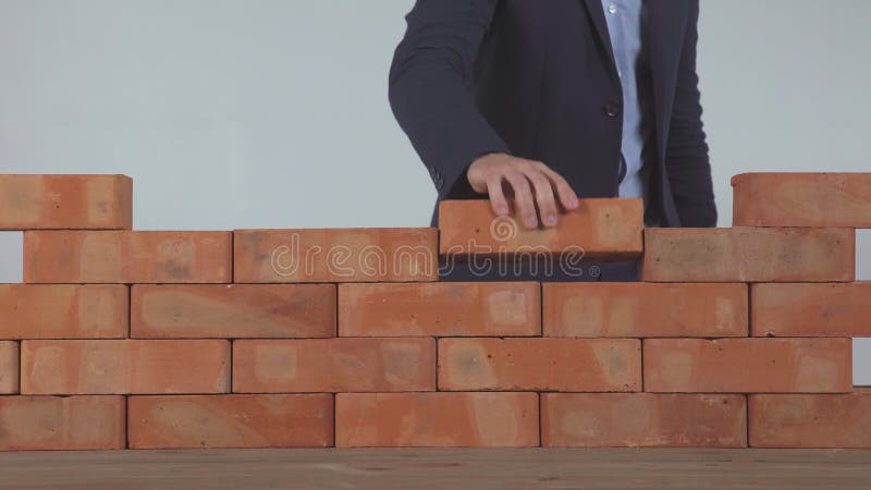 Hand Puts the Brick into the Wall Stock Video - Video of currency ...