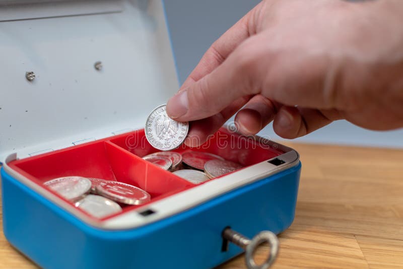 Hand Puts a Coin in a Blue Cash Box Stock Image - Image of deposit ...