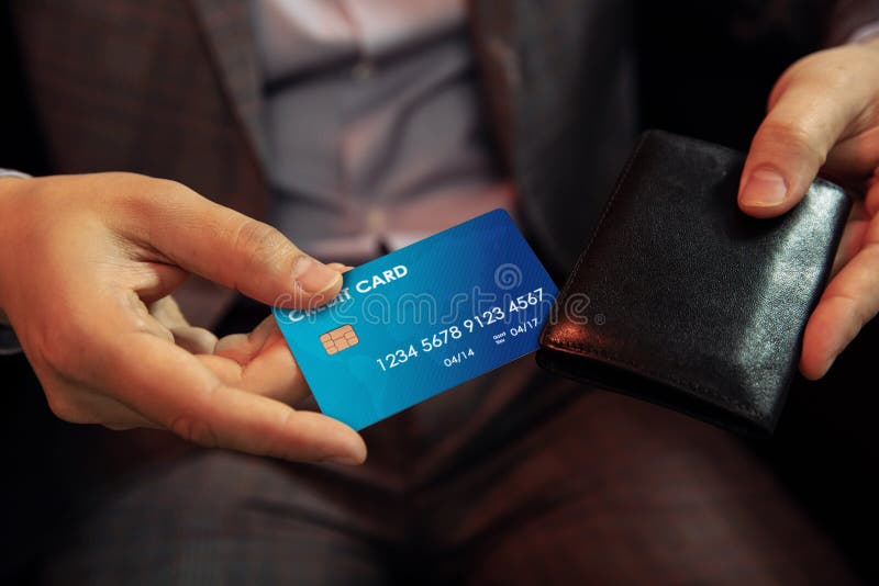 Hand Puts Out Credit Card from Wallet Stock Photo - Image of puts ...