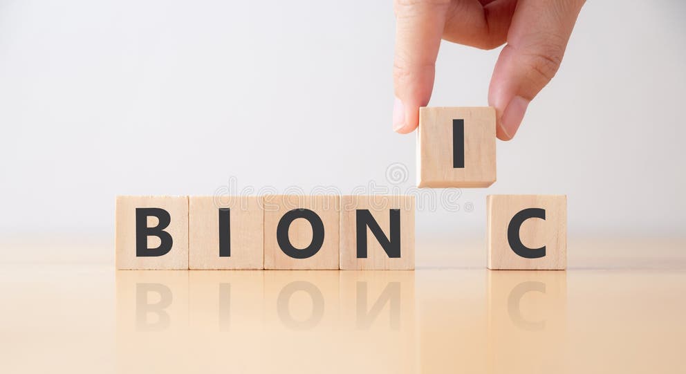 Hand Puts Wooden Cubes with BIONIC on Table Stock Photo - Image of ...