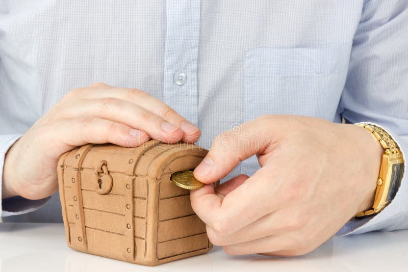 Hand Putting Coin into a Money-box Stock Image - Image of moneybox ...