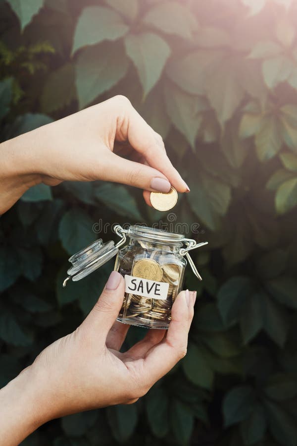 Hand Putting Coins in Glass Jar with SAVE Label Stock Image - Image of ... Hand Putting Coins in Glass Jar with SAVE Label Stock Image - Image of ...