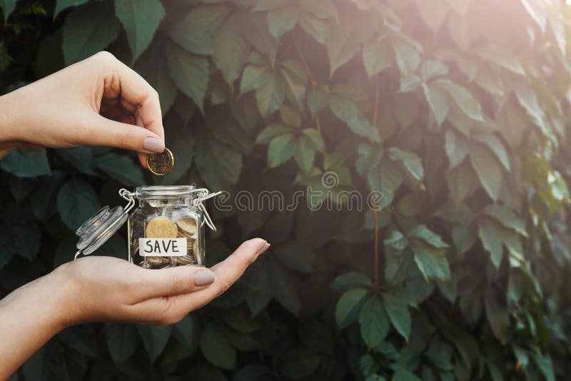 Hand Putting Coins in Glass Jar with SAVE Label Stock Photo - Image of ... Hand Putting Coins in Glass Jar with SAVE Label Stock Photo - Image of ...