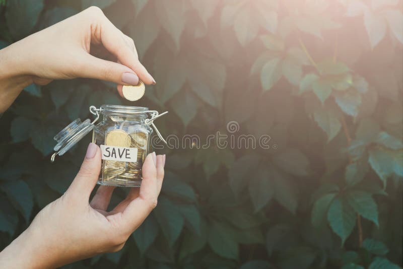 Hand Putting Coins in Glass Jar with SAVE Label Stock Photo - Image of ... Hand Putting Coins in Glass Jar with SAVE Label Stock Photo - Image of ...