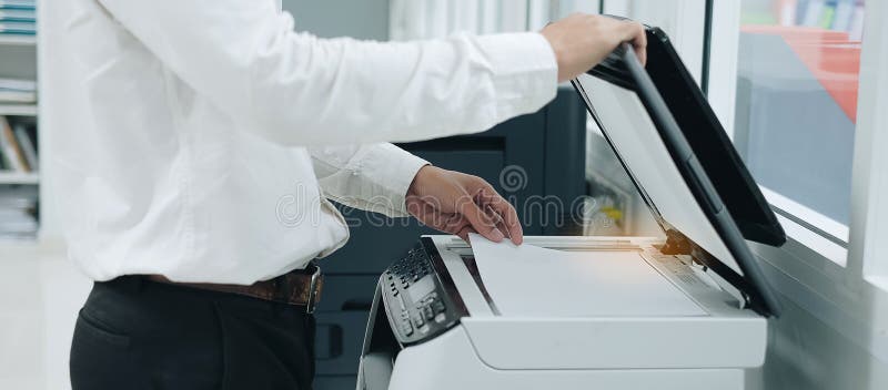 Hand Putting a Document Paper into Printer Scanner or Laser Copy ...