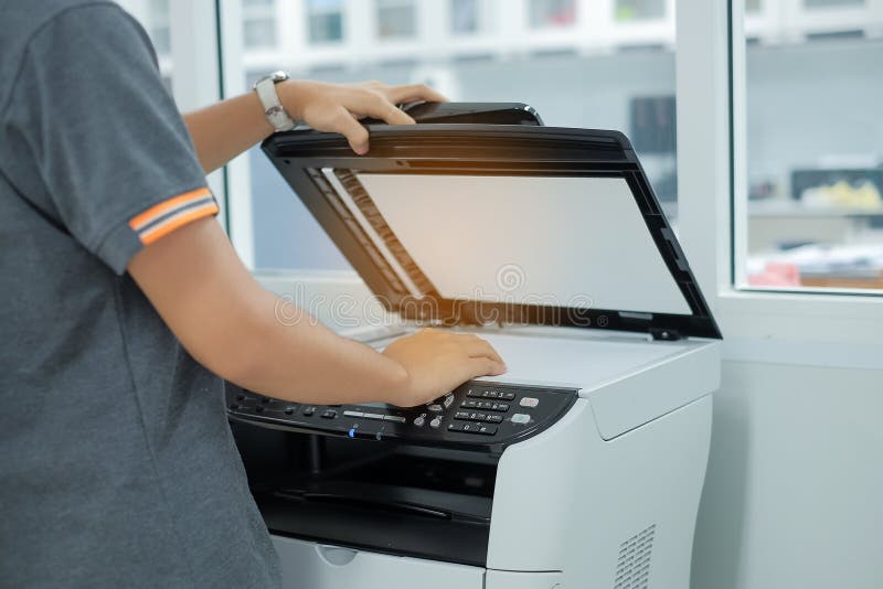 Hand Putting a Document Paper into Printer Scanner or Laser Copy ...