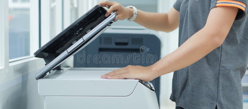 Hand Putting a Document Paper into Printer Scanner or Laser Copy ...