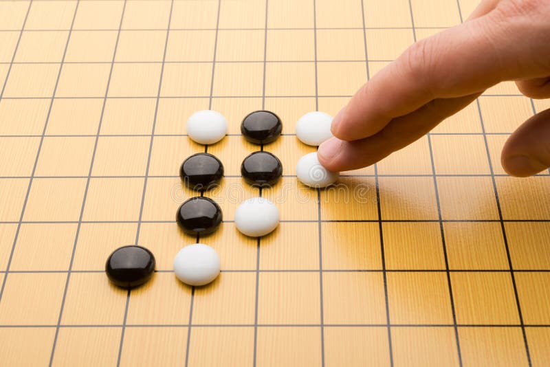 Hand Putting Down Piece of GO Stock Image - Image of hand, game: 93101761