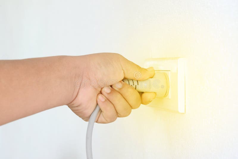 Hand Putting Electrical Plug into Socket. Stock Photo - Image of outlet ...