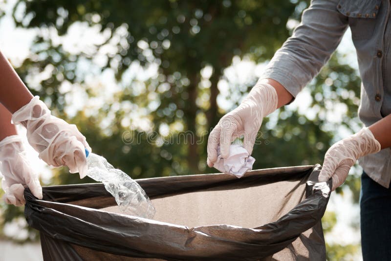 Hand Putting Empty Plastic Bottle in To Garbage Bag Stock Image - Image ...