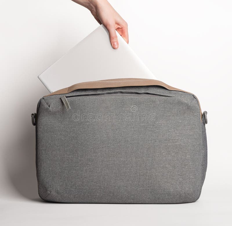 Hand Putting Laptop Computer into Notebook Bag, Briefcase Stock Image ...