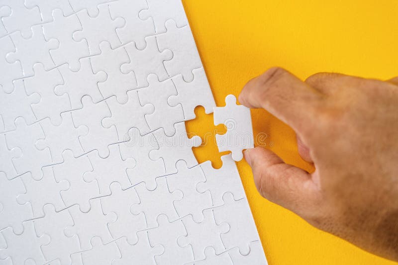 Hand Putting the Last Piece To Solve Jigsaw Puzzle Stock Image - Image ...