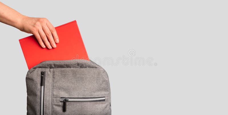 Hand Putting Red Book, Textbook into Backpack, School Bag. Banner ...