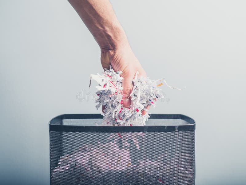 Hand with shredded paper stock photo. Image of shredder - 37871158